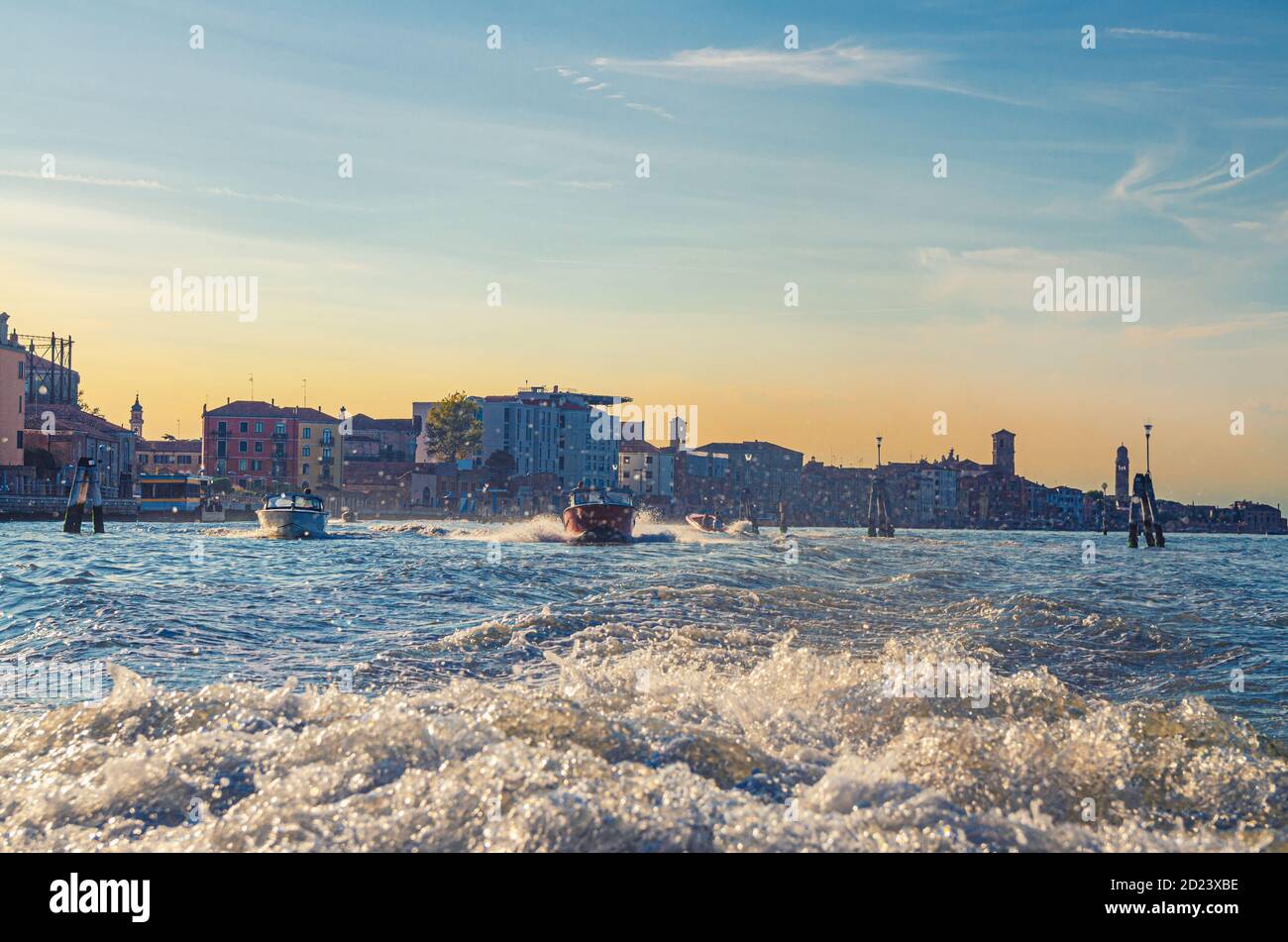 Yacht boats racing sailing on water of Venetian lagoon between wooden ...