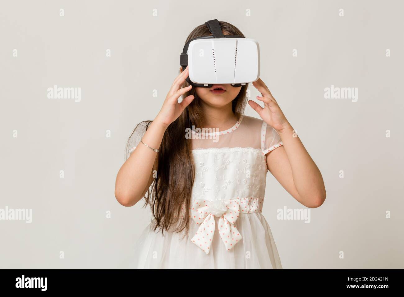 Young girl wearing virtual reality VR goggles Stock Photo - Alamy