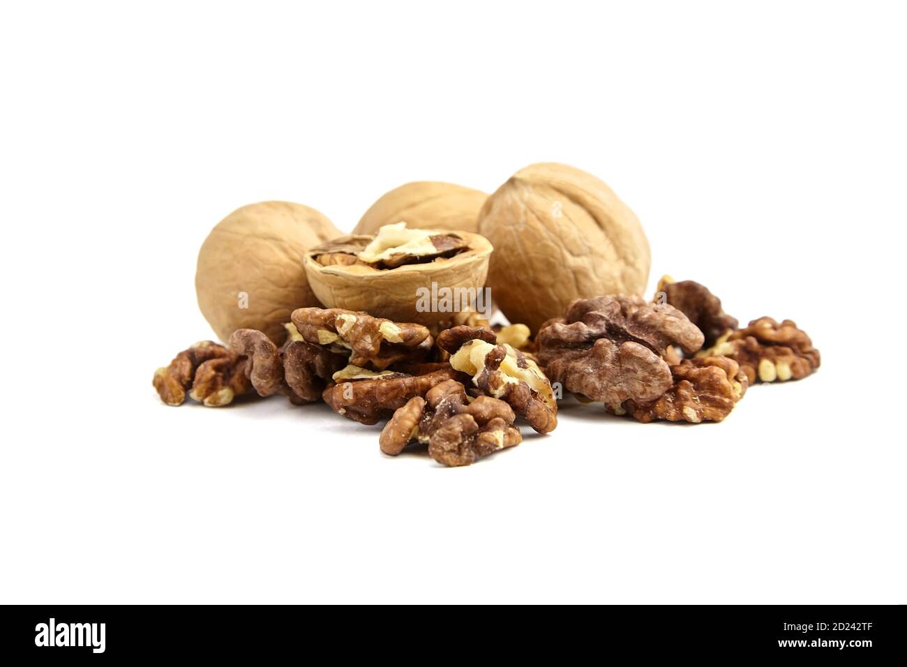 Dry walnuts heap isolated on white background Stock Photo - Alamy