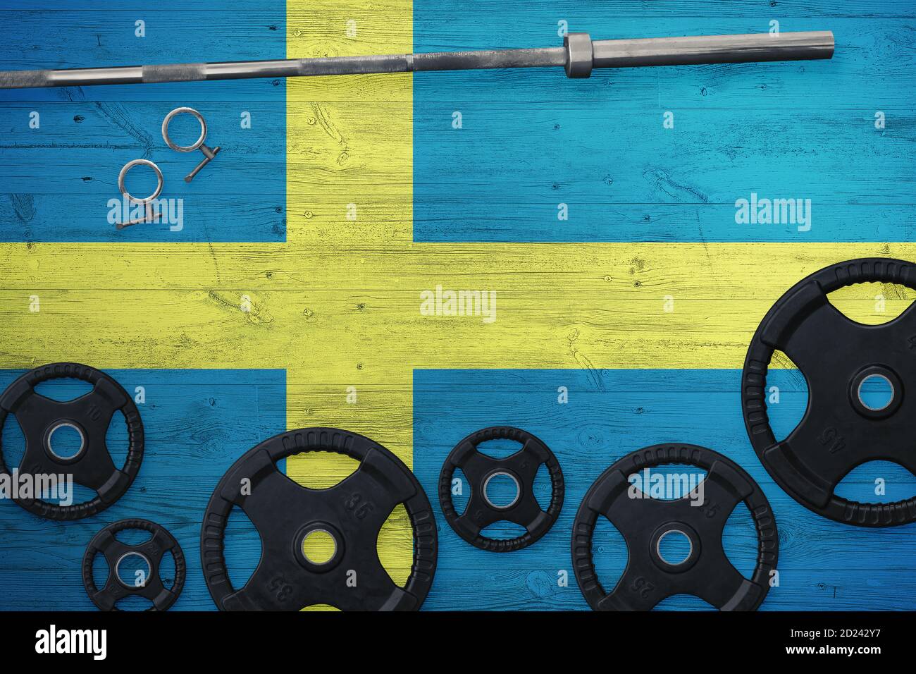 Sweden gym concept. Top view of heavy weight plates with iron bar on ...
