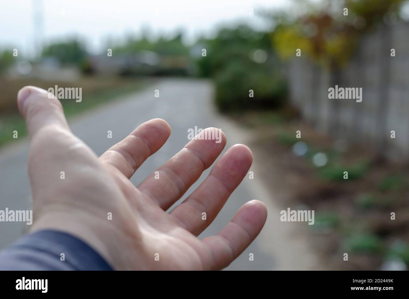One hand reaching out palm up hi-res stock photography and images - Alamy