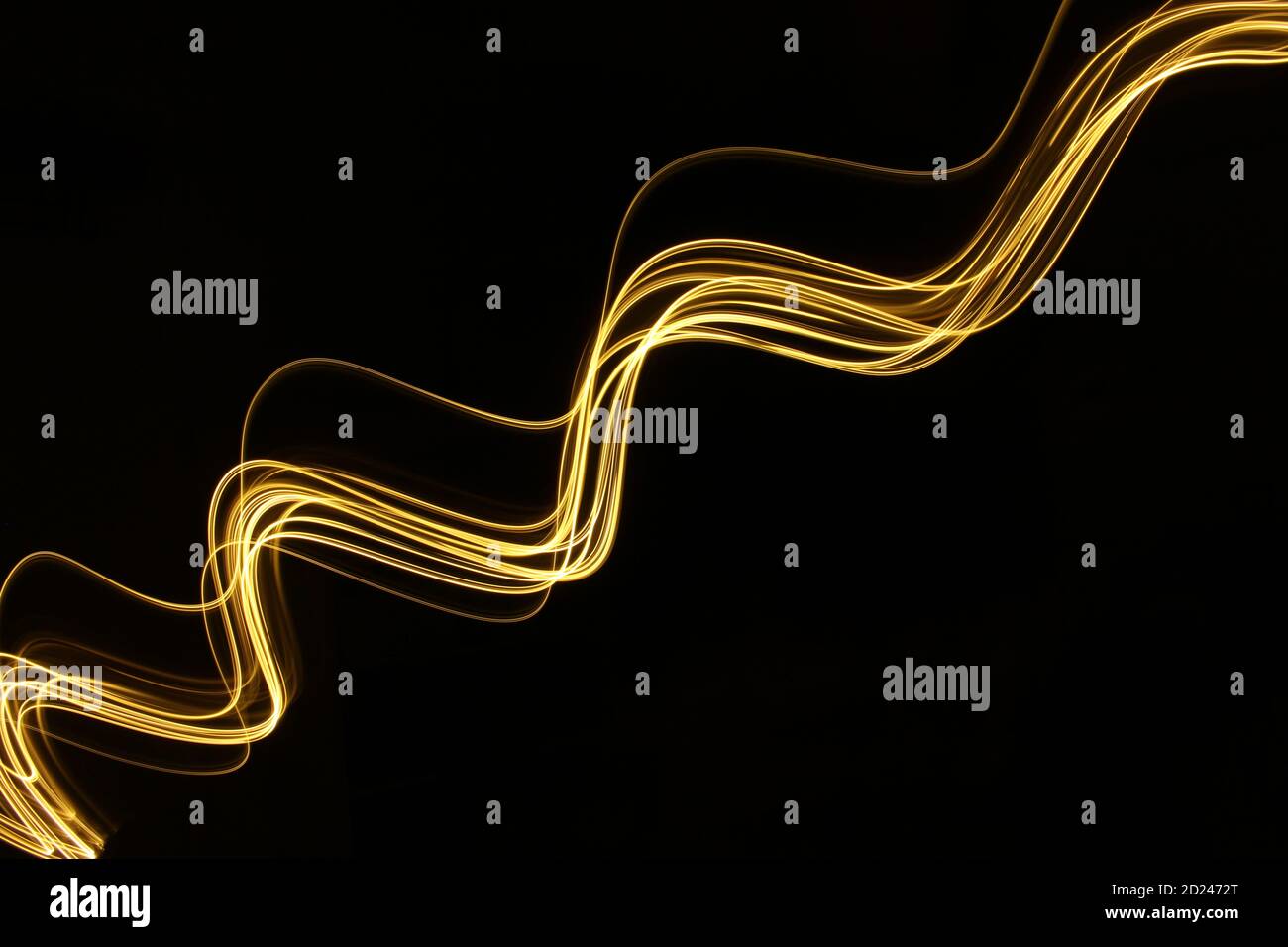 Long exposure photograph of neon colour in an abstract swirl, parallel ...