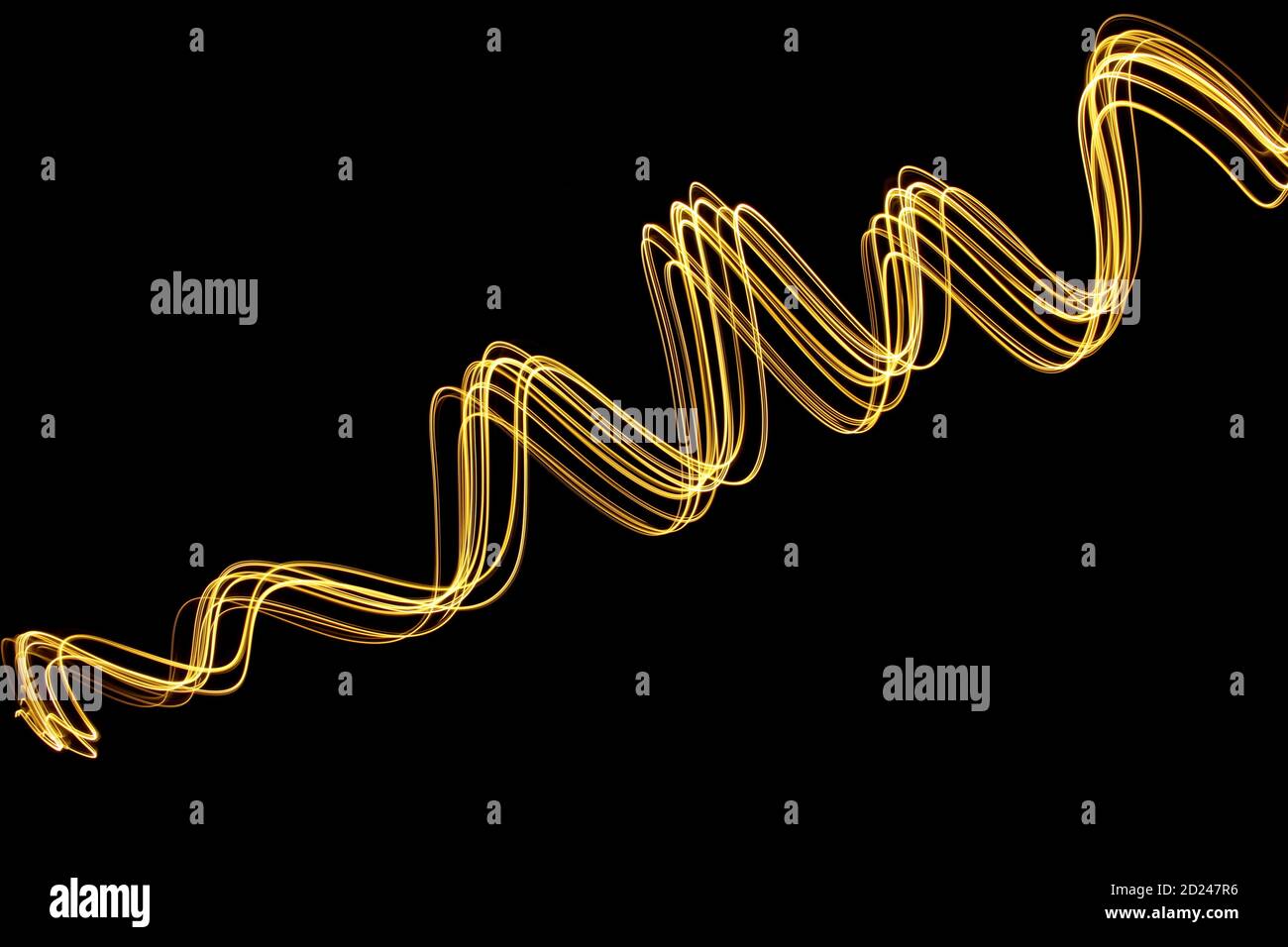 Long exposure photograph of neon colour in an abstract swirl, parallel ...