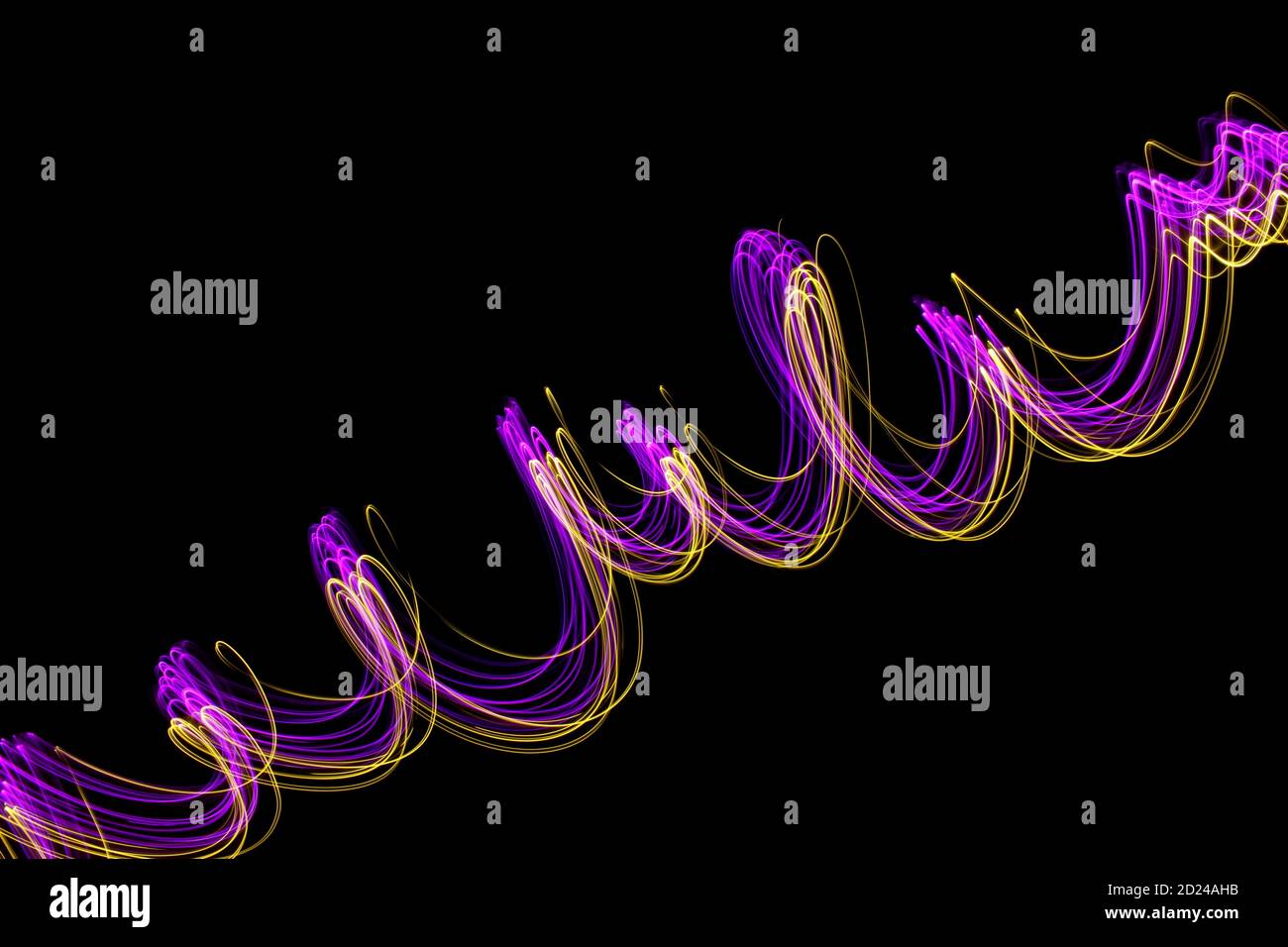 Long exposure photograph of neon colour in an abstract swirl, parallel ...