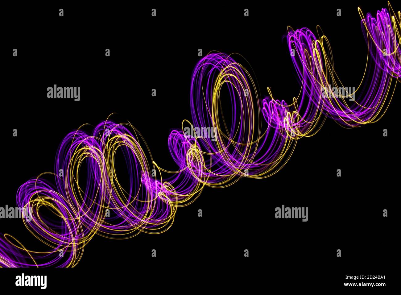 Long exposure photograph of neon colour in an abstract swirl, parallel ...