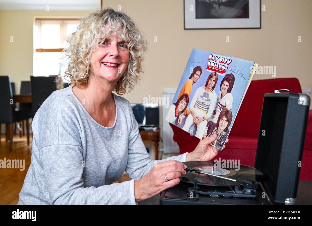 Middle Aged woman with a copy of the Bay City Rollers album Rollin ...