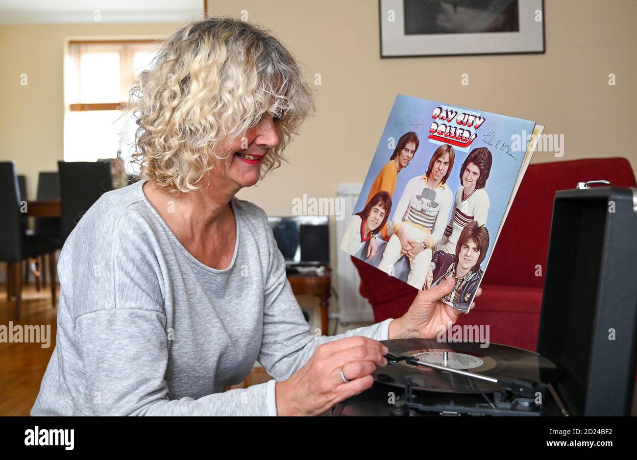 Middle Aged woman with a copy of the Bay City Rollers album Rollin ...