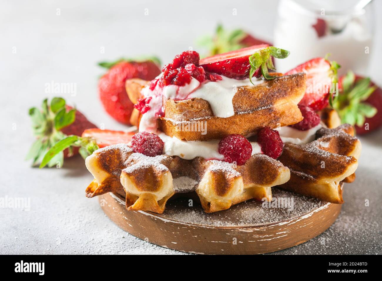Belgian waffles with creem and raspberries and strawberries Stock Photo ...