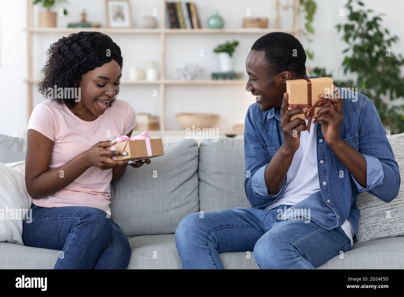 Couple opening gift boxes hi-res stock photography and images - Alamy