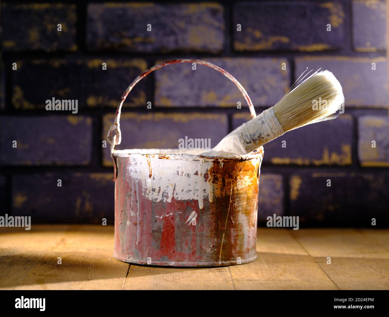 Paint tin bucket splattered with red and white paint with old paint ...