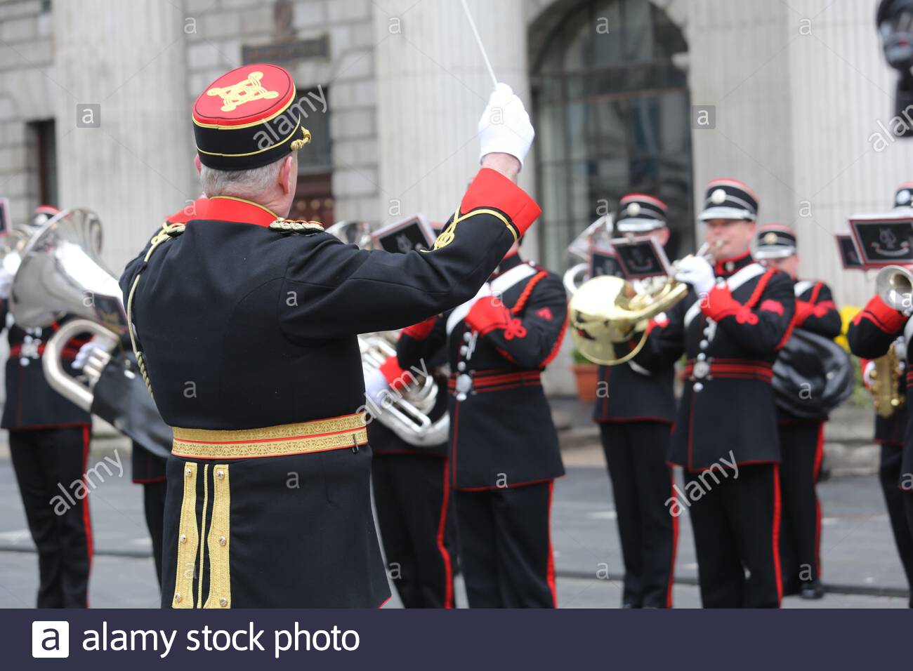 A band leader conducts his band during a parade in Dublin to celebrate ...