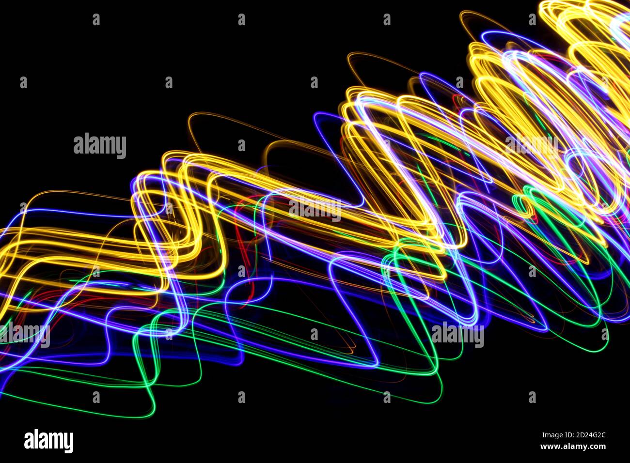 Long exposure photograph of neon colour in an abstract swirl, parallel ...