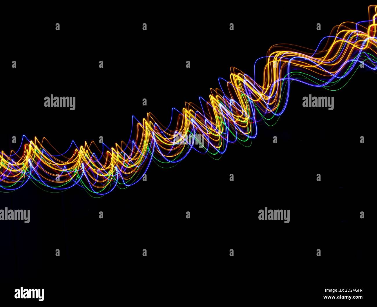 Long exposure photograph of neon colour in an abstract swirl, parallel ...