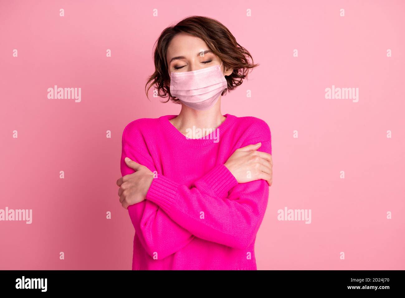 Photo of attractive lady hands hug herself shoulders enjoy joyful soft ...