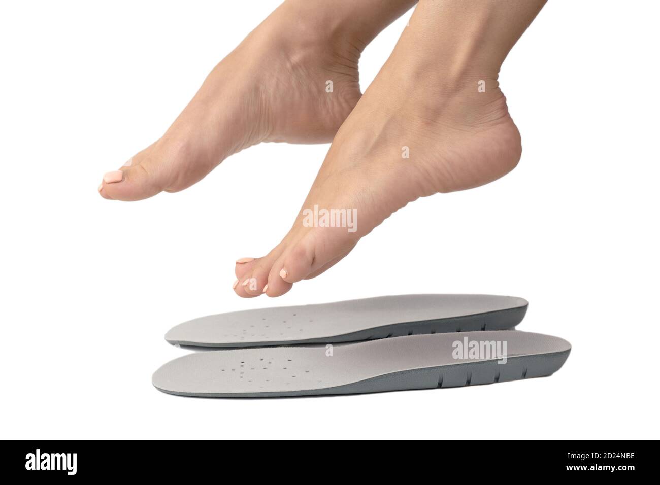 Female feet and insoles isolated on a white background Stock Photo - Alamy
