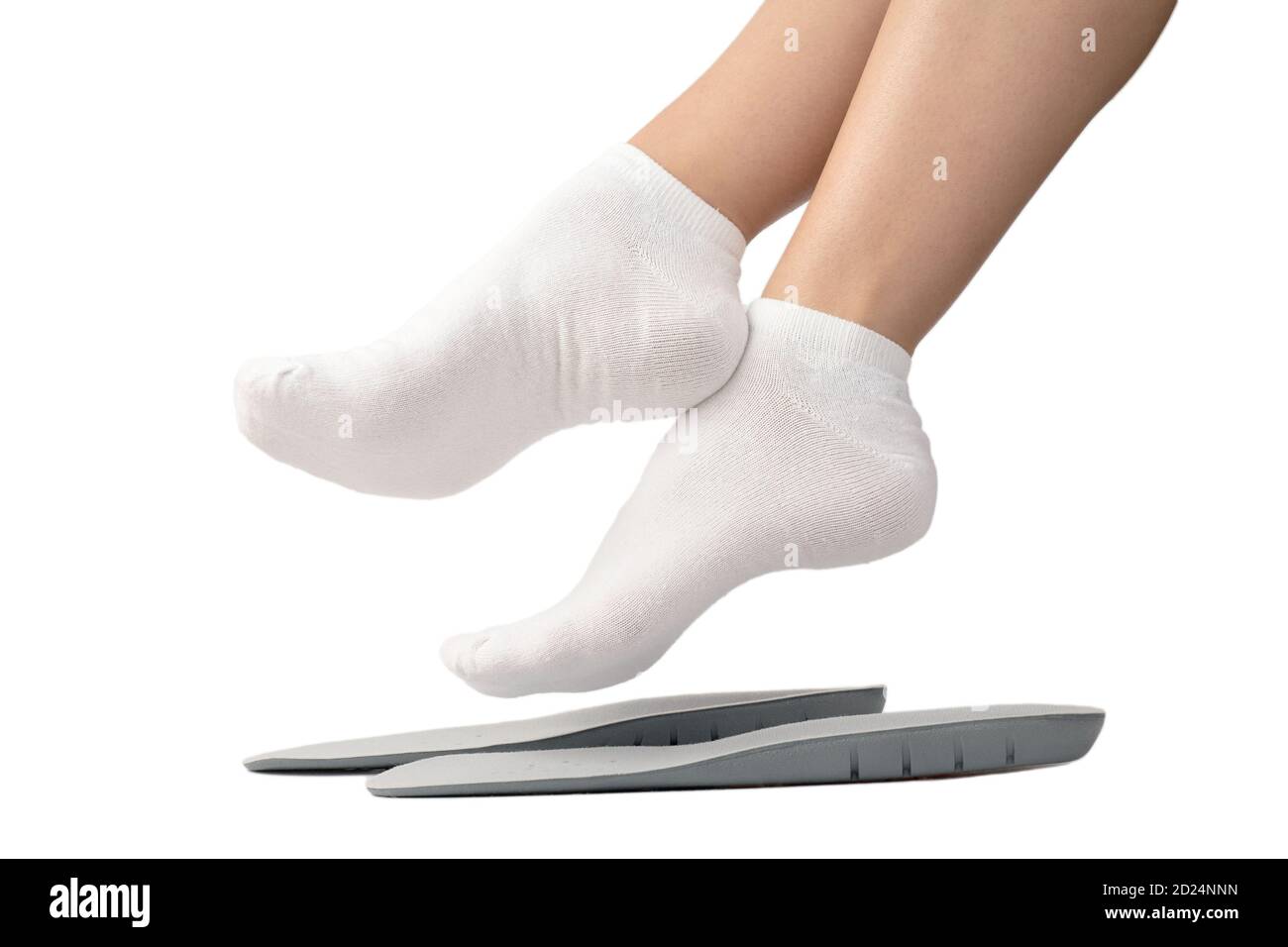 Female feets in white socks and insoles isolated on a white background ...