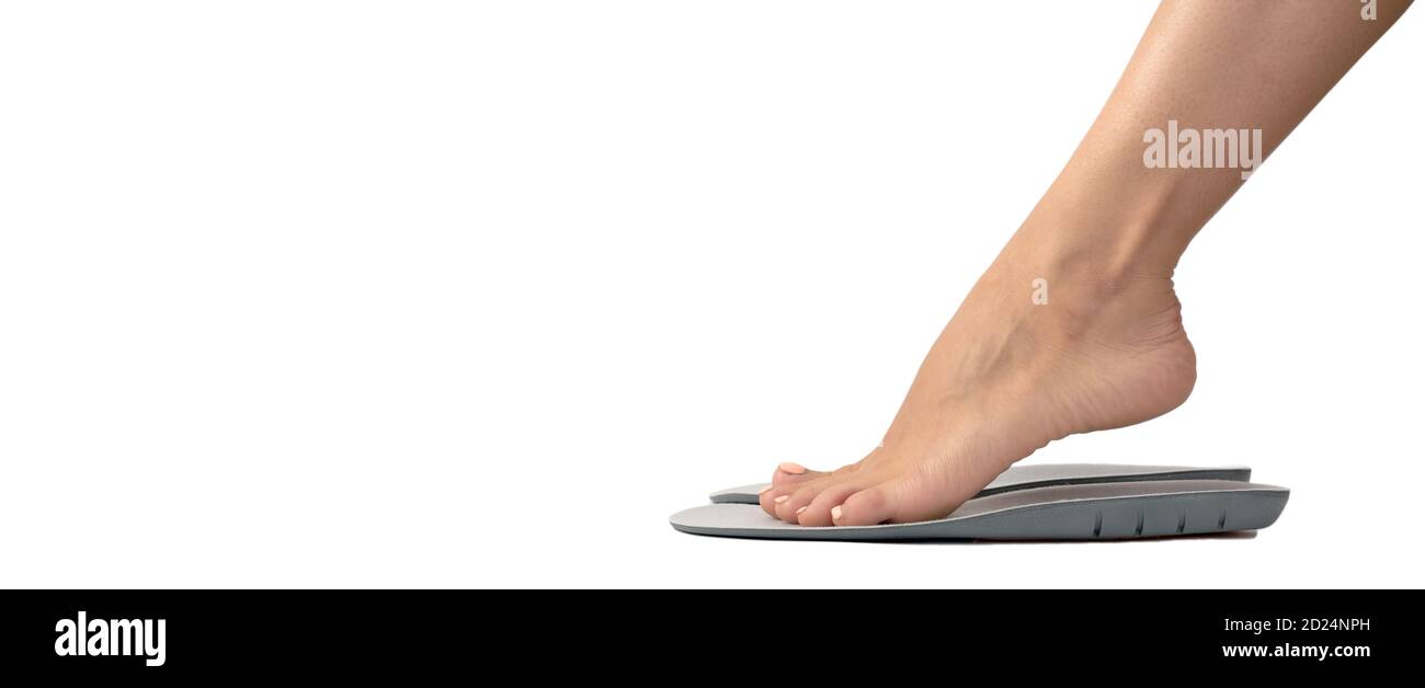 Female feet and insoles isolated on a white background Stock Photo - Alamy