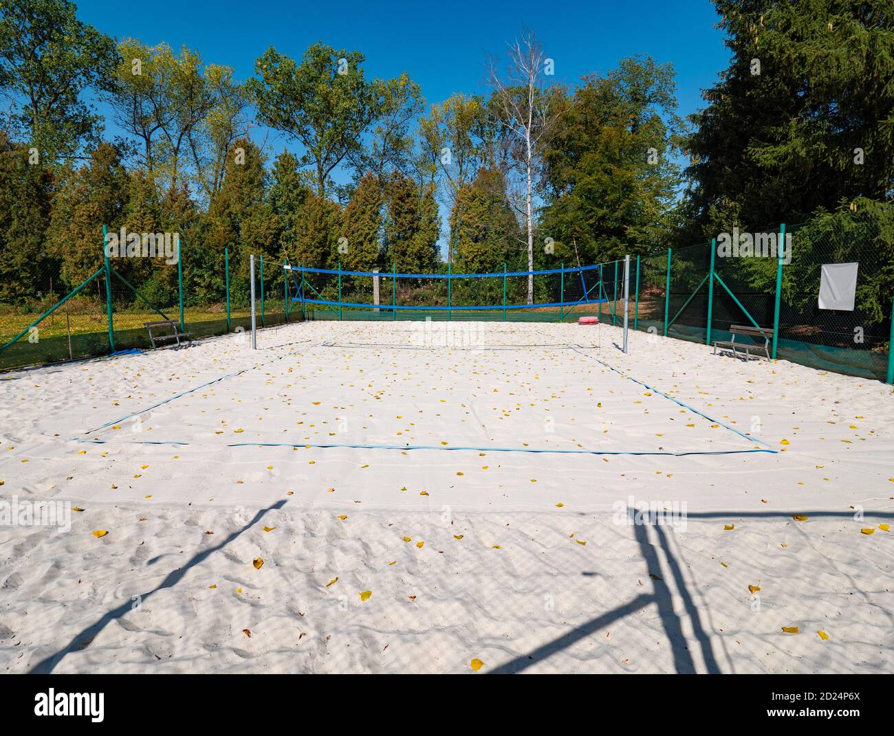 Closed beach volleyball court in fall season. Autumn weather and fallen ...