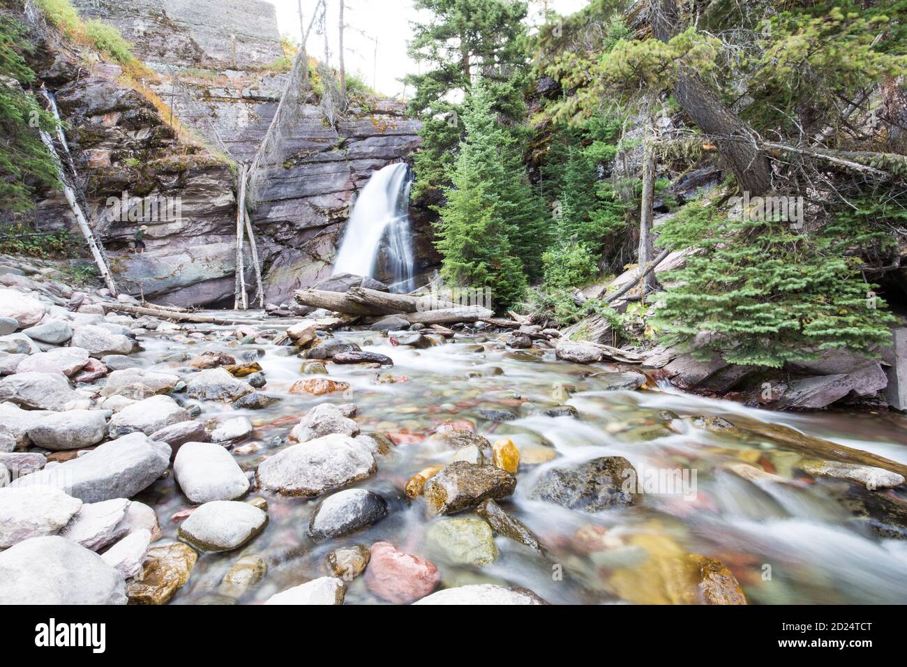 Soothing waterfall & colorful rocks in Glacier National Park, Montana ...