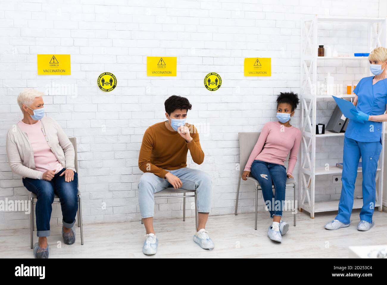 Patients Keeping Distance From Sick Man Coughing Sitting In Hospital ...