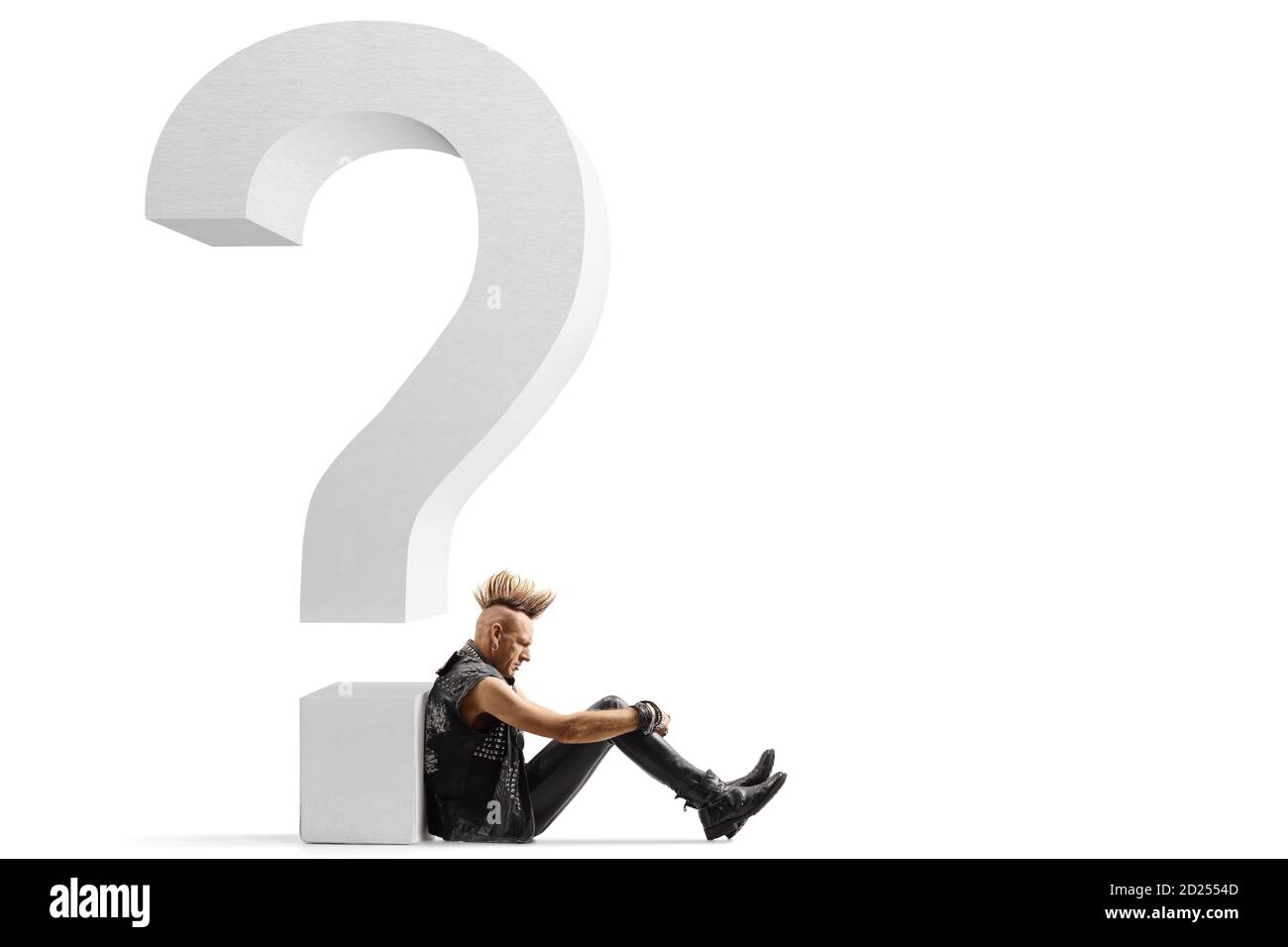 Punk rocker with a mohawk sitting on the ground thinking and leaning on ...