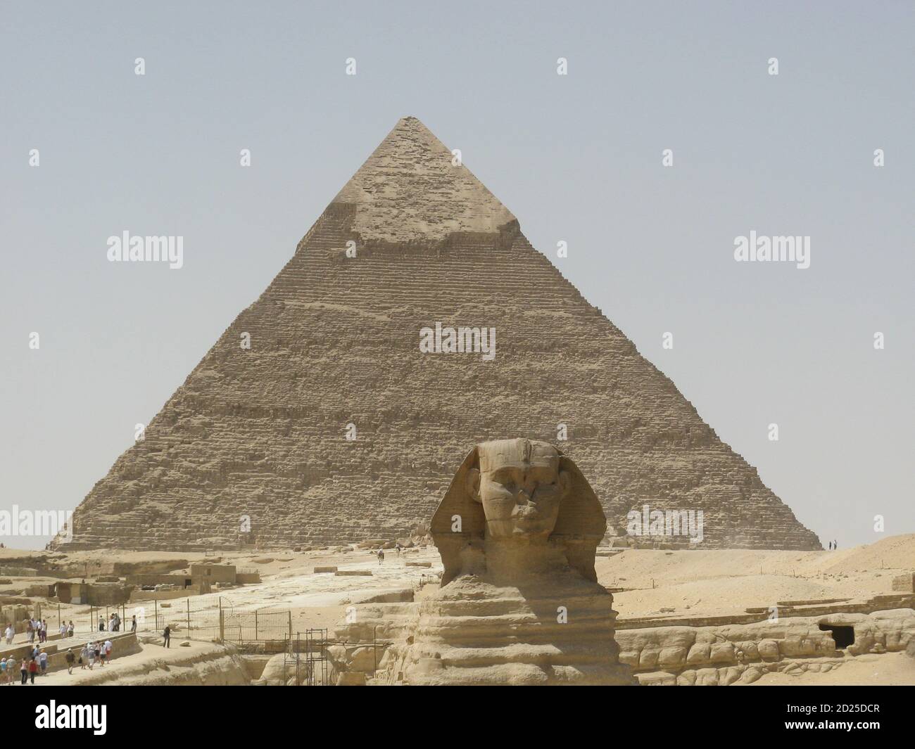 The Sphinx with the Great Pyramid of Giza in the background Stock Photo ...