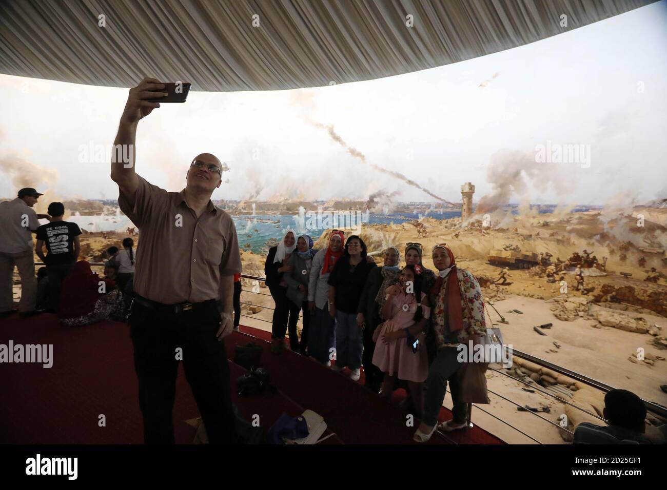 Cairo, Egypt. 6th Oct, 2020. People take selfies at the 6th of October ...