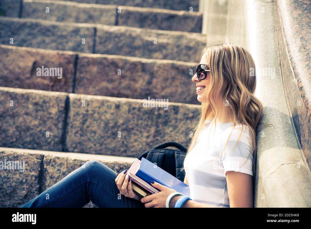 Student girl at staircase Stock Photo - Alamy