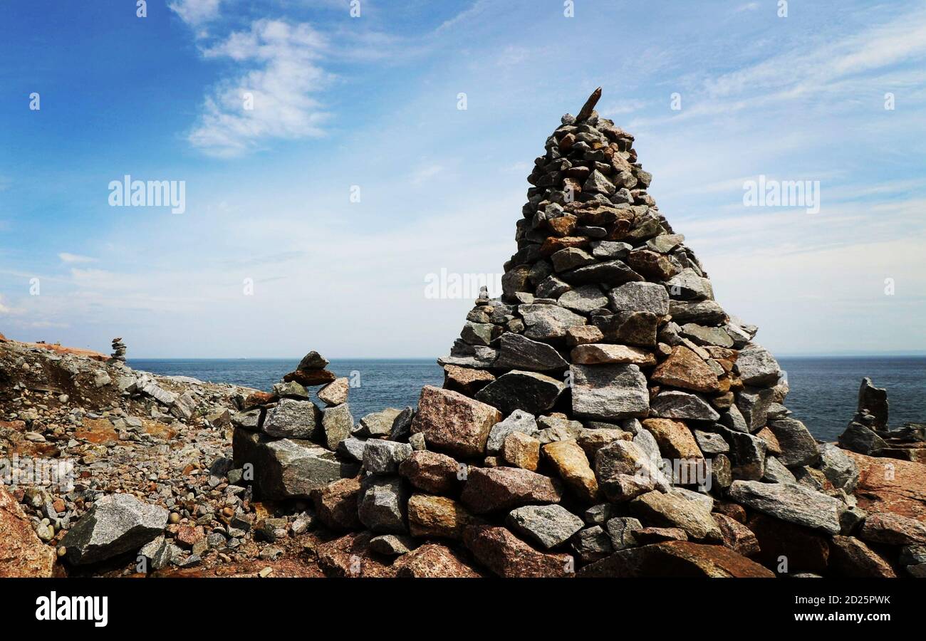 A beautiful pile of rocks on the shore (inukshuk Stock Photo - Alamy