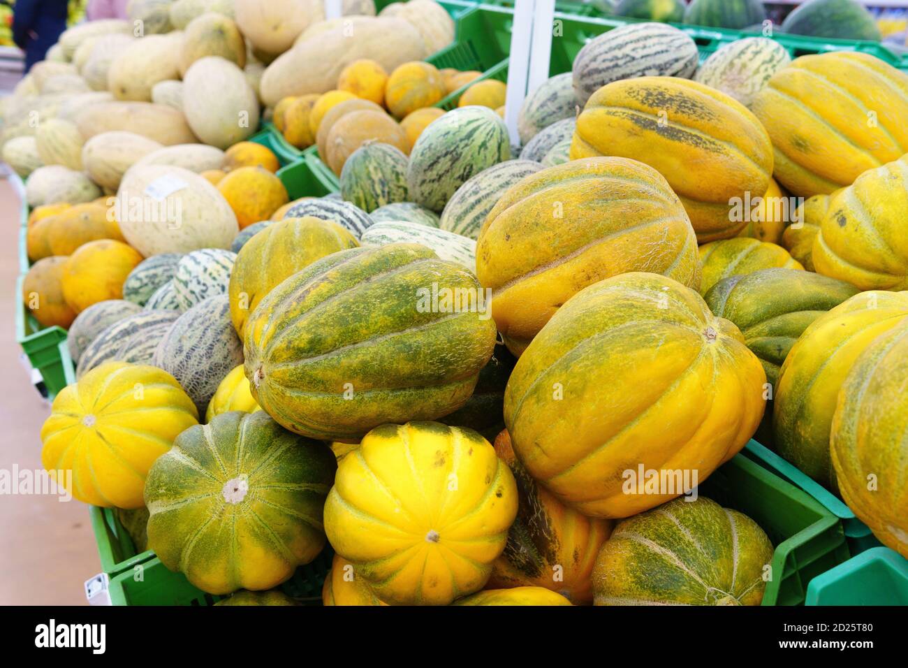 fresh melons in a bin at a street market. Close-up. Sale of fresh ...