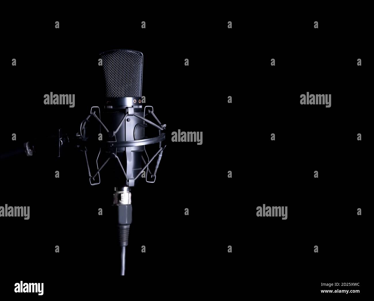 Condenser microphone on black background Stock Photo - Alamy