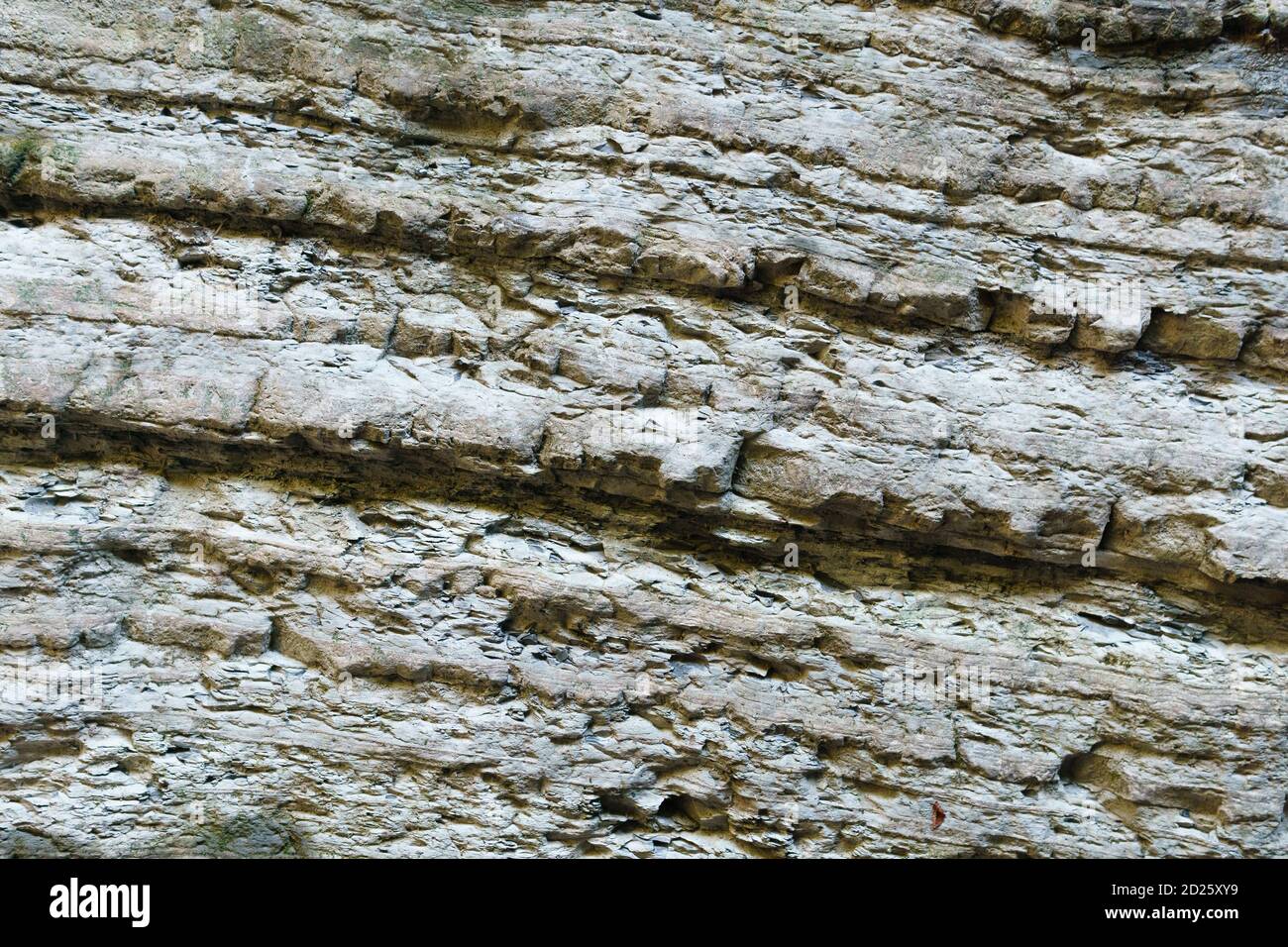 background layers in sedimentary rock on cliff face. Cliff of rocky ...