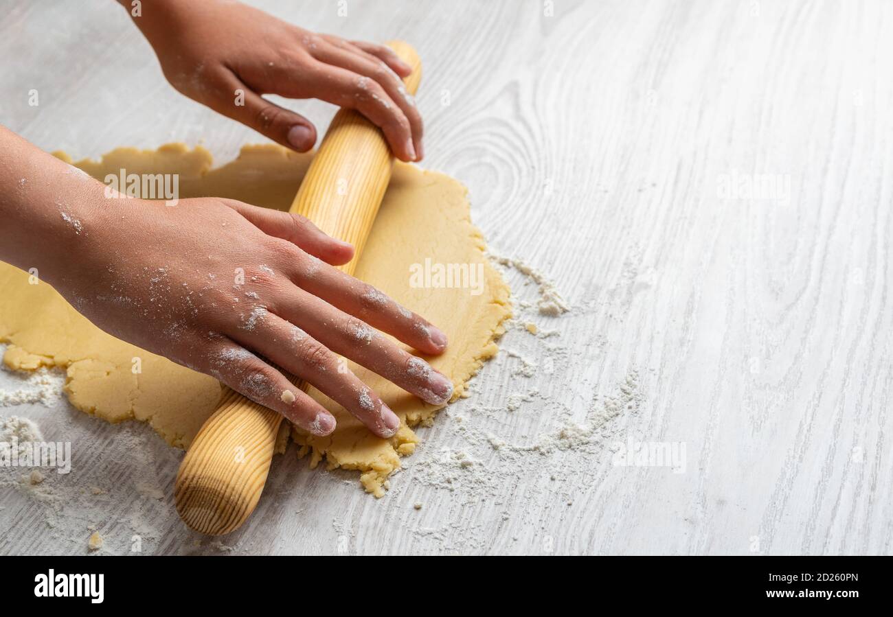 Hands kneading with a rolling pin Stock Photo - Alamy