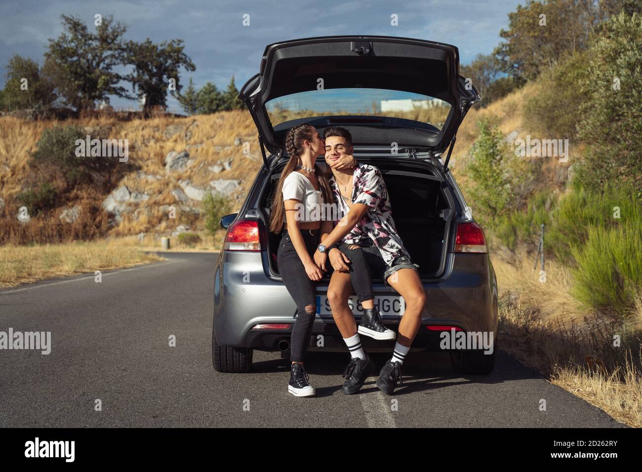 Couple sitting in car boot while waiting for tow truck to arrive Stock ...