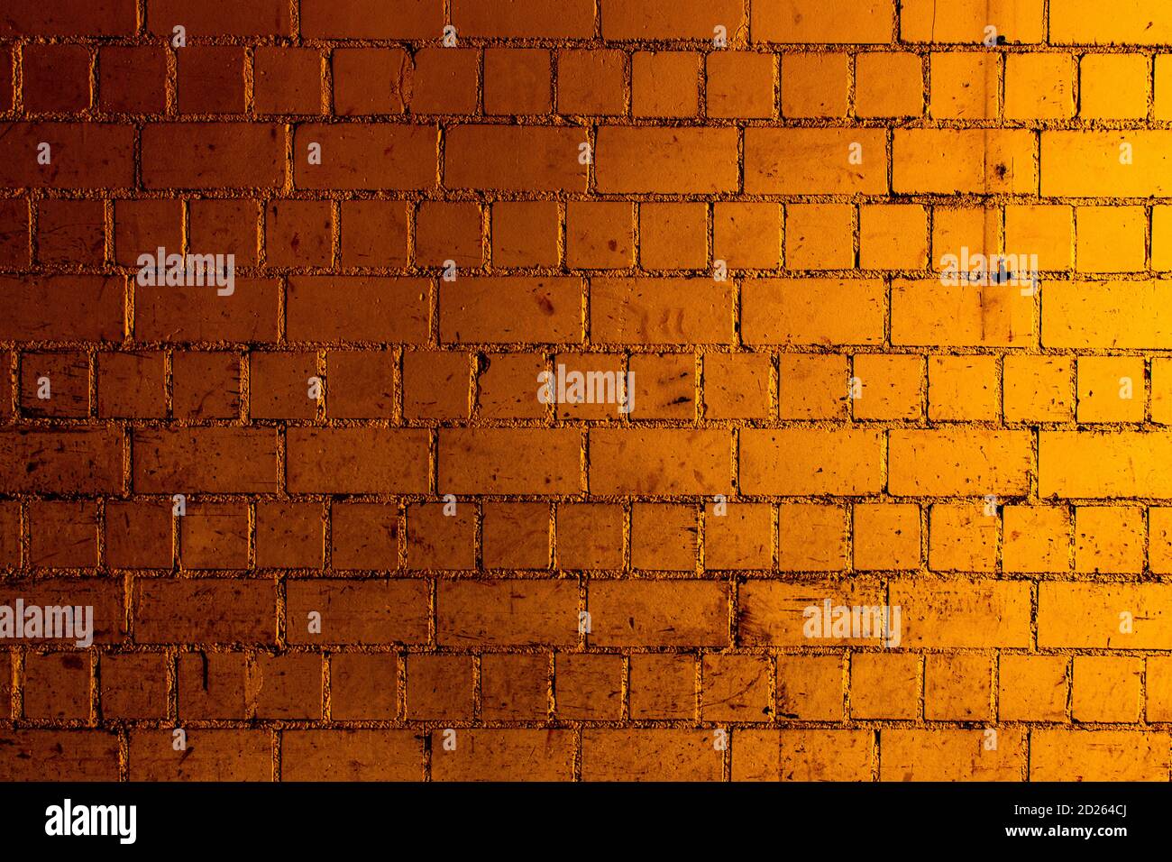 Orange brick wall background with shades of light and dark orange Stock ...