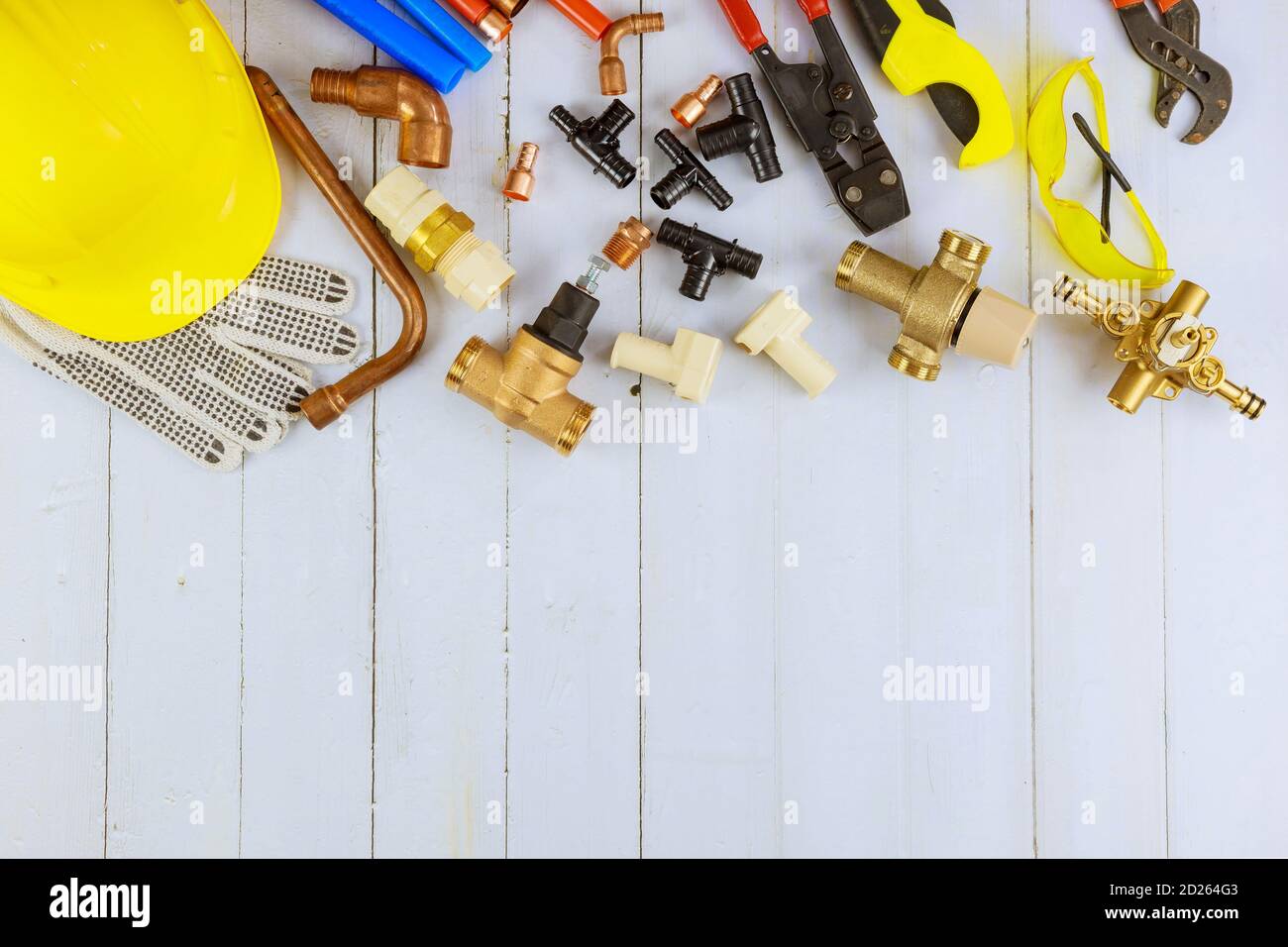 Various plumbers tools, pipe fittings on a home improvement plumbing ...