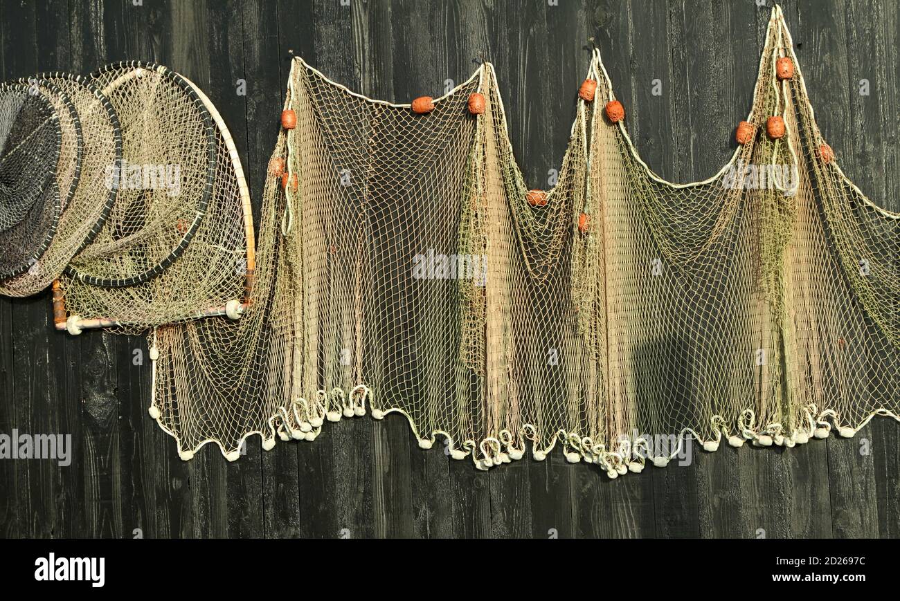 Fishing net hanging on a wall hi-res stock photography and images - Alamy