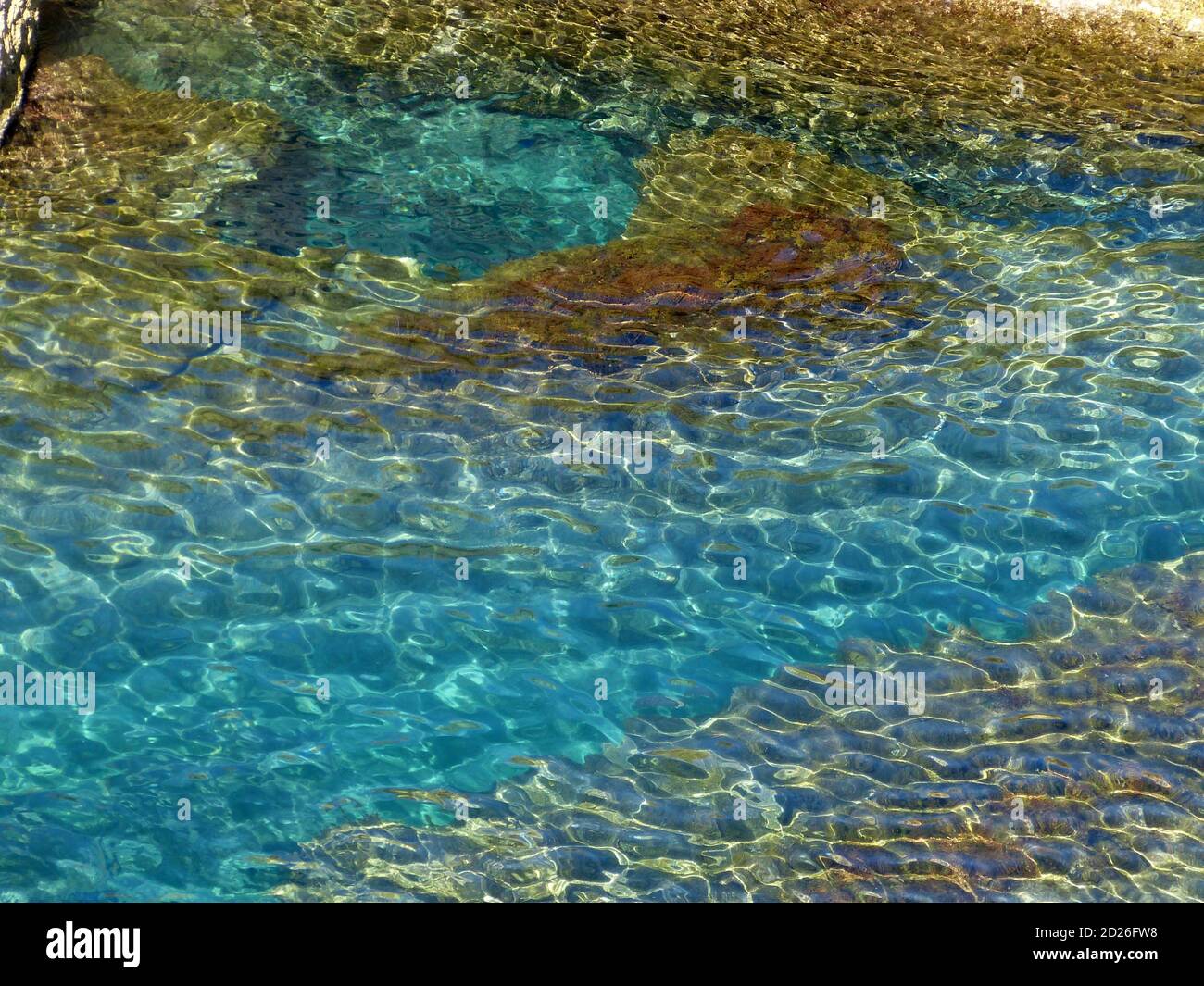 Turquoise tranquil blue crystal clear sea ripple water surface ...