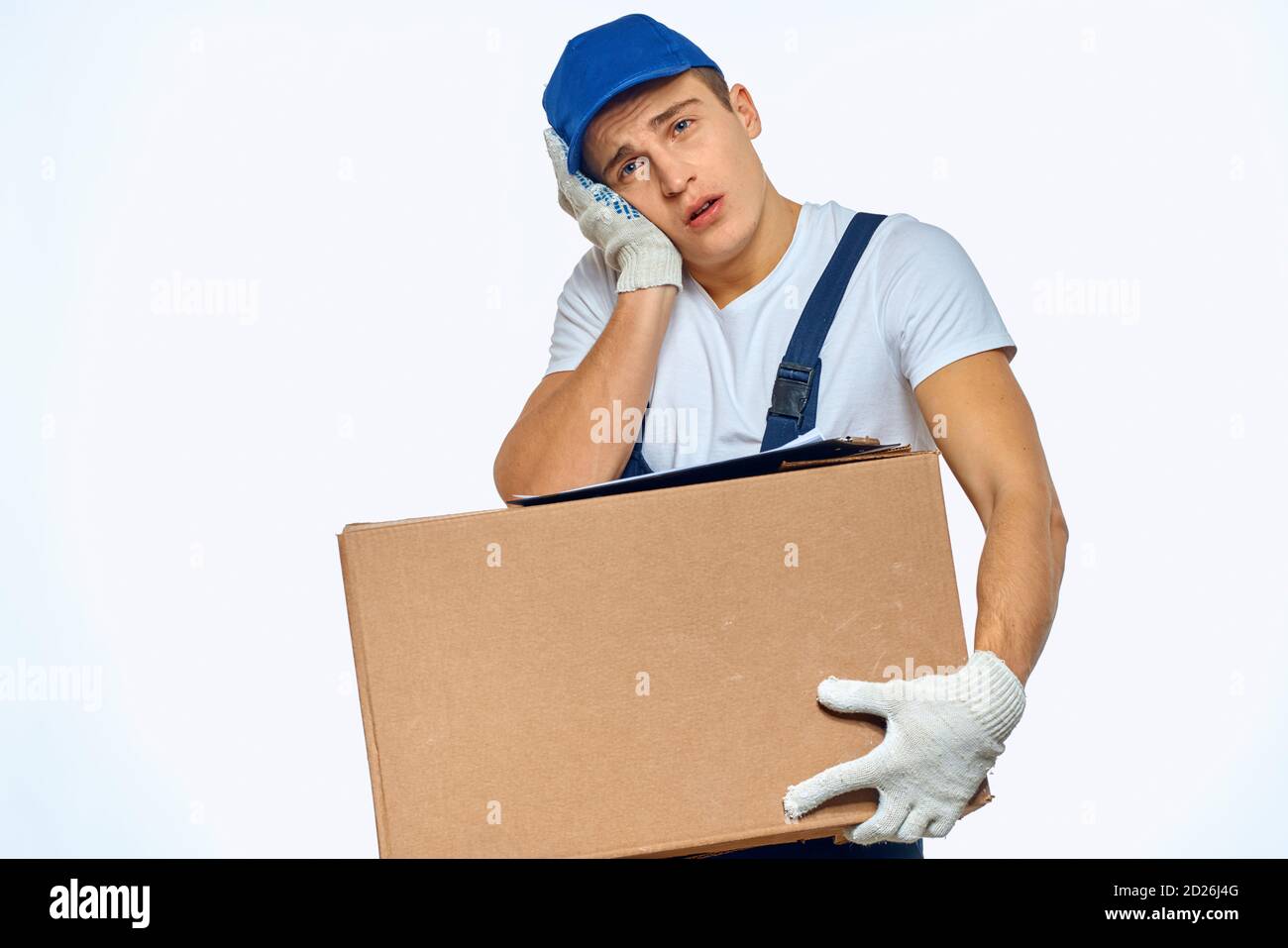 Man worker with box in hands delivery loading service work light ...