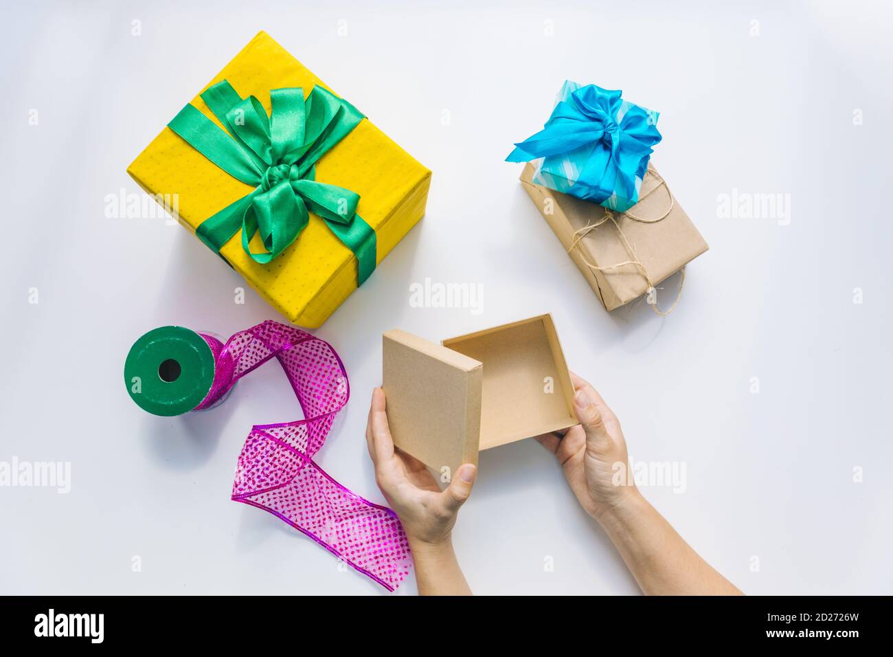 hand giving decorated present box Stock Photo - Alamy