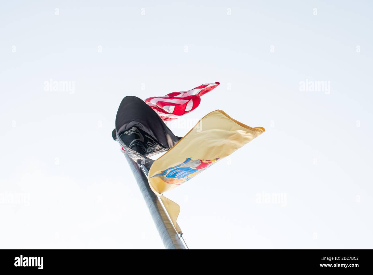 Three Flags Flying in a Grey Sky, One Being a US Flag Stock Photo - Alamy