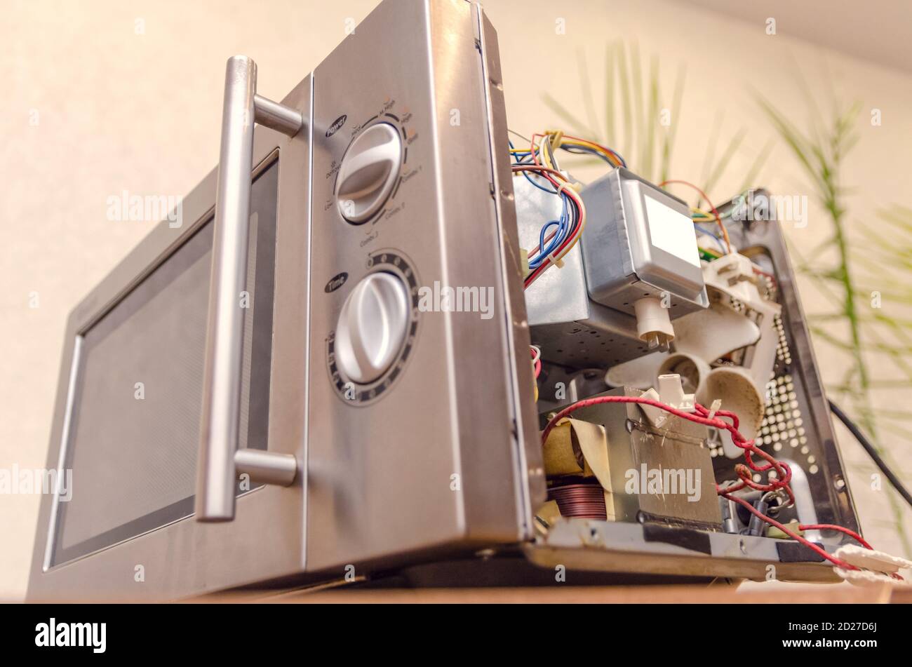 half-disassembled microwave oven is ready for repair, close-up photo ...
