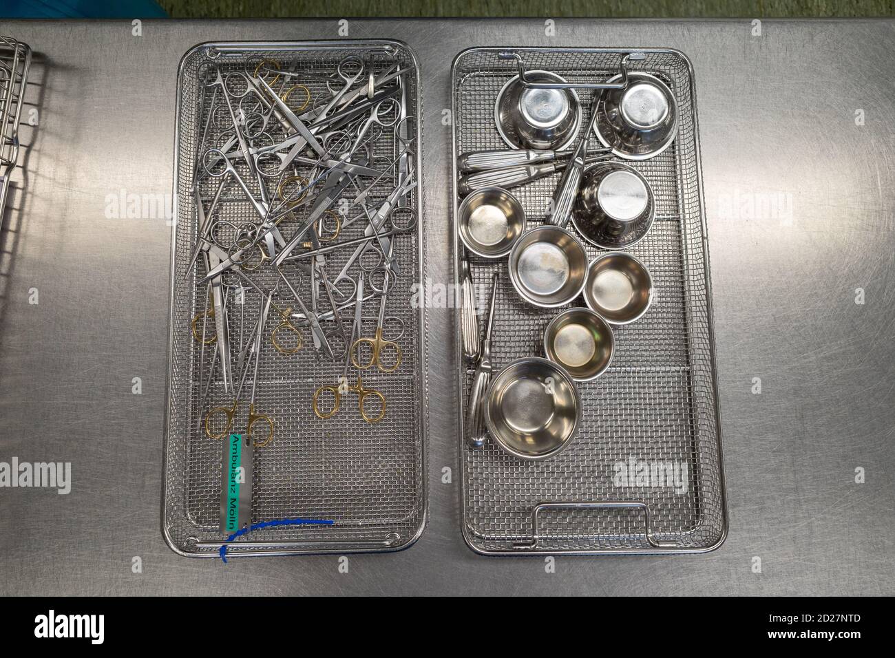 various cleaned and disinfected surgical instruments lie unsorted in ...