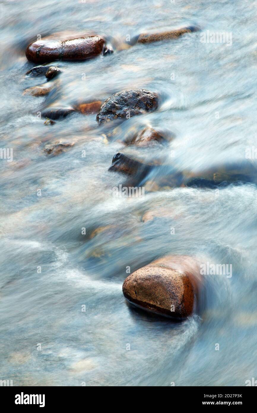 Water flowing over rocks in a small creek Stock Photo - Alamy