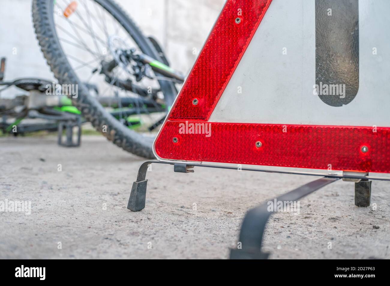 Accident on the road. Bike and road emergency sign close up on the road ...