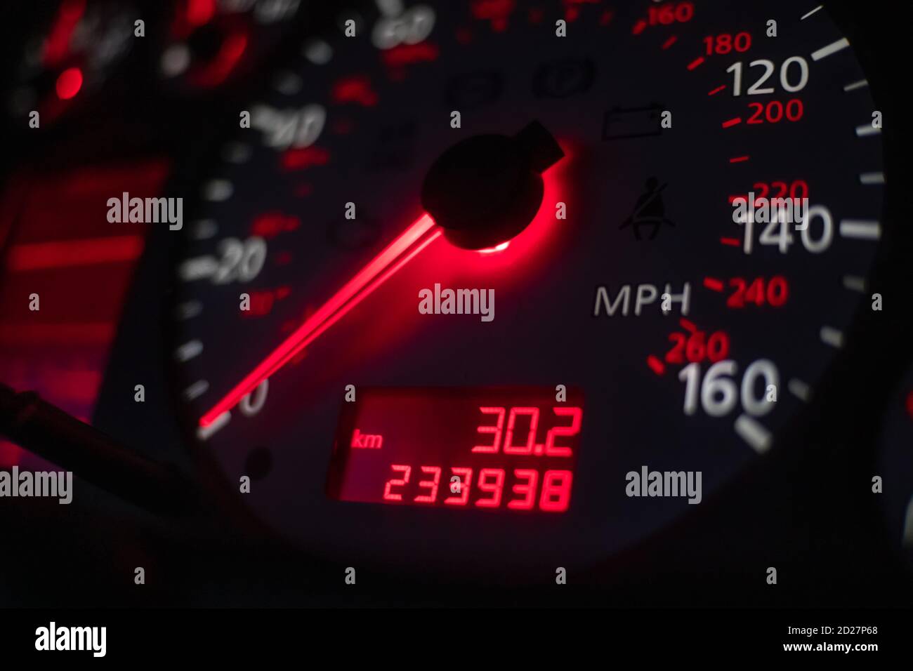 car dashboard. Speedometer with red backlight at night close up Stock ...