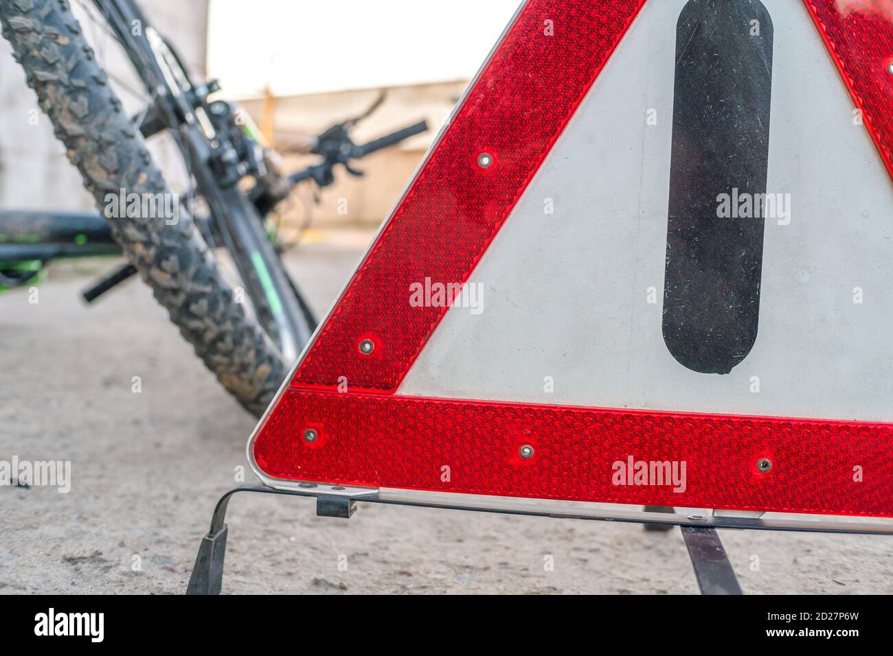 Accident on the road. Bike and road emergency sign close up on the road ...