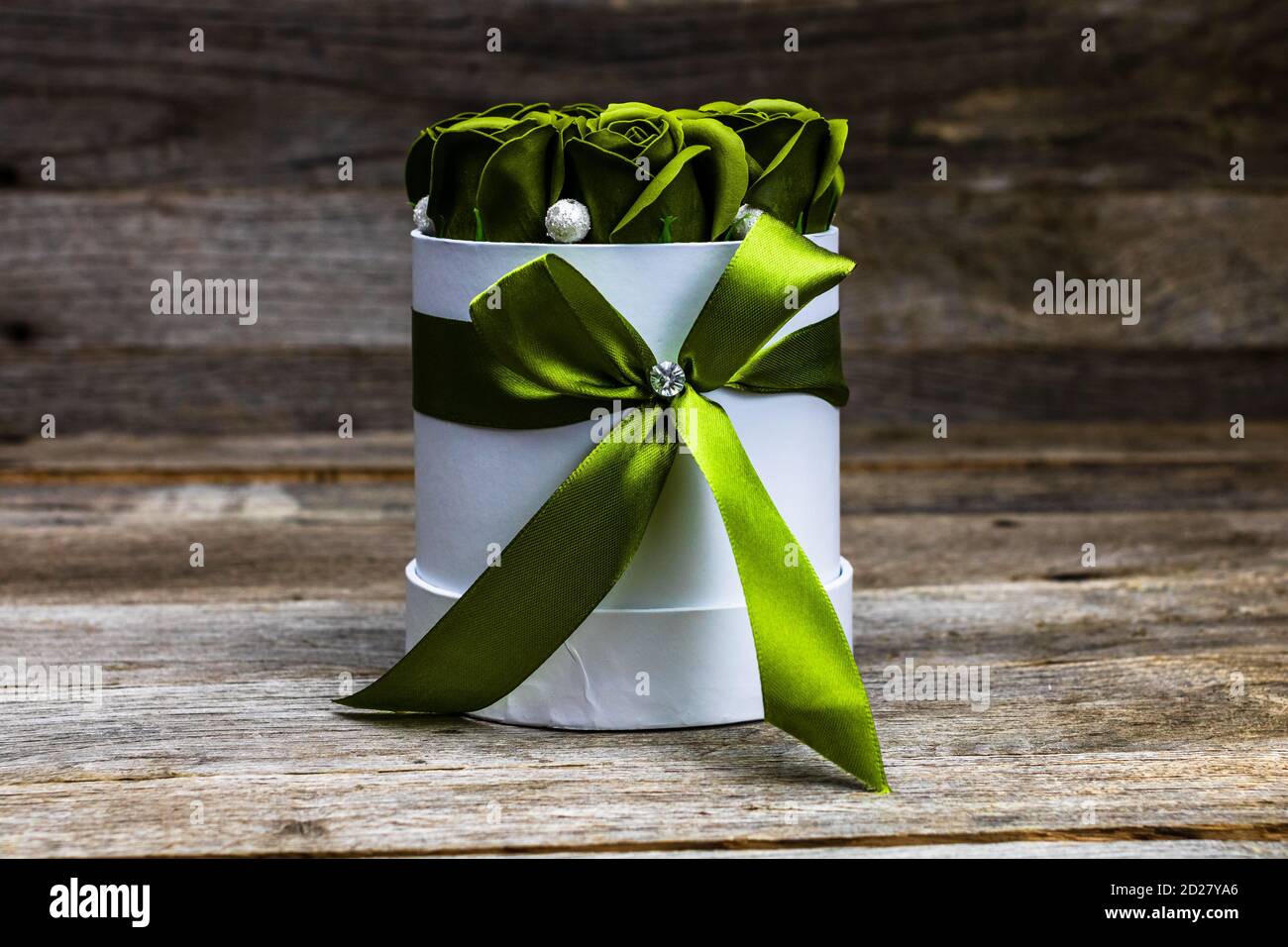 Green roses in a round luxury present box. Bouquet of flowers in a ...