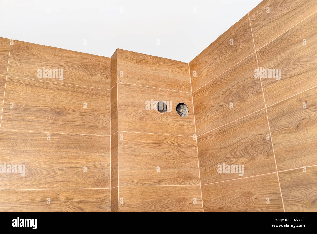 Modern gas boiler room with brown ceramic tiles imitating wood, empty ...