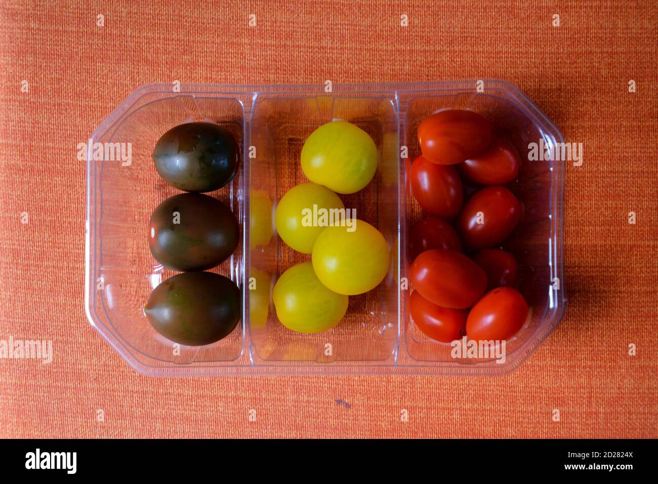 Multicolored cherry tomato bunch Stock Photo - Alamy